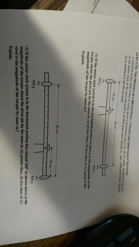 Solved A massless meter stick is free to rotate about a | Chegg.com