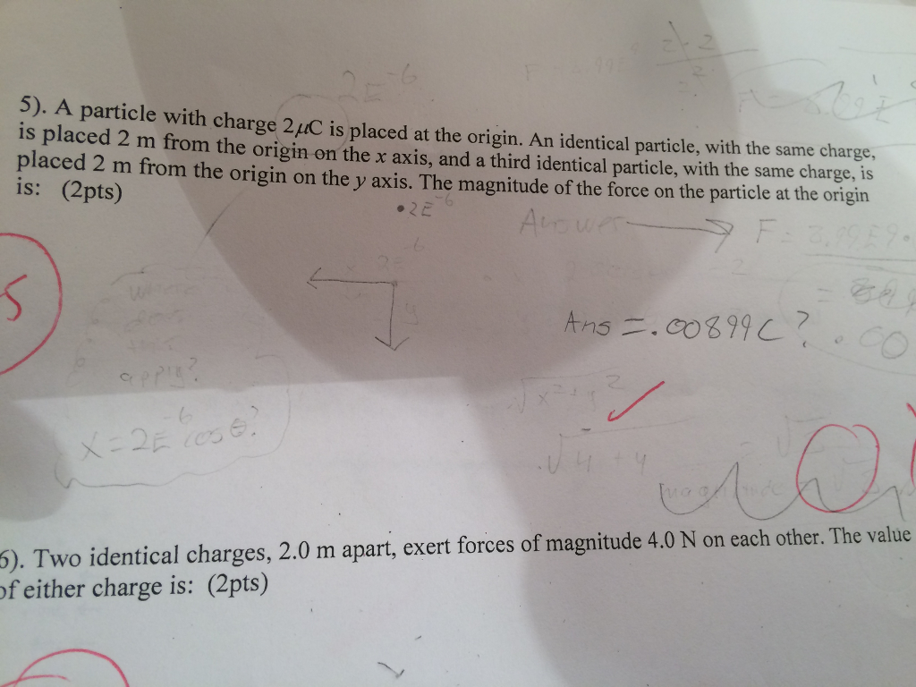 Solved A particle with charge 2 mu C is placed at the | Chegg.com