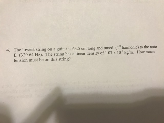 Solved The lowest string on a guitar is 63.5 cm long and | Chegg.com