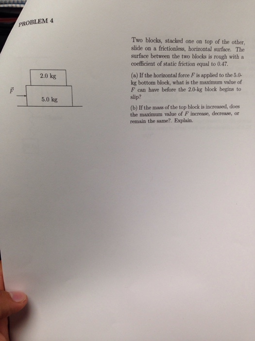 Solved Two blocks, stacked one on top of the other, slide on | Chegg.com