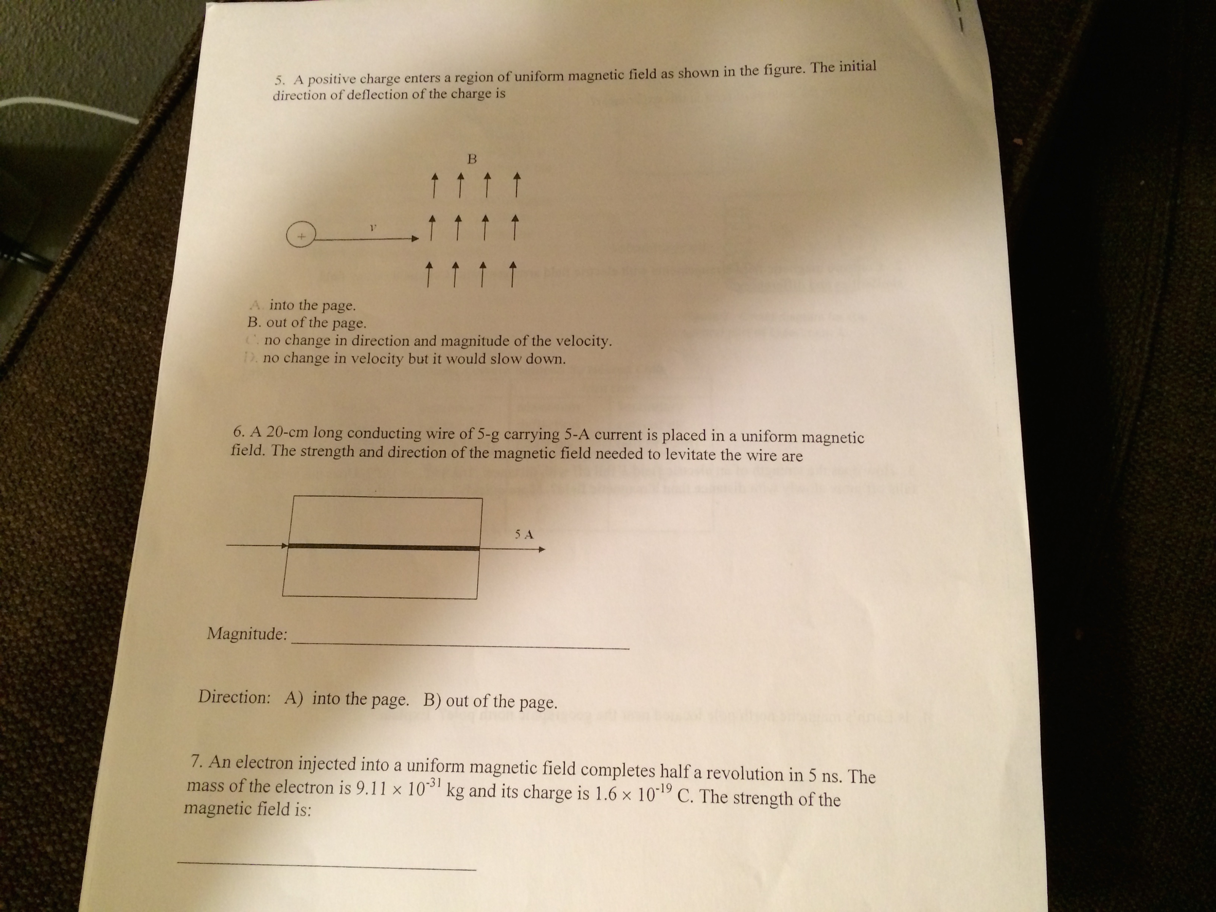 Solved A positive charge enters a region of uniform magnetic | Chegg.com