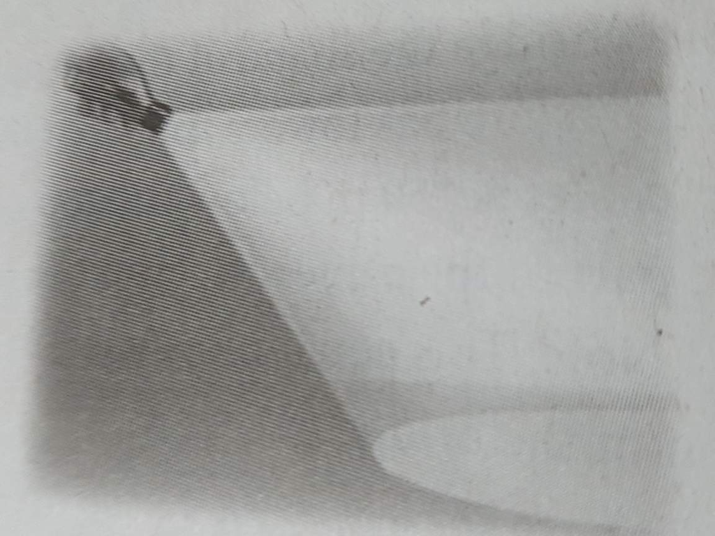 Solved A flashlight is held to form a lighted area on the | Chegg.com