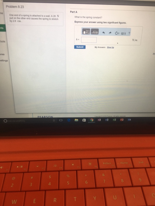 Solved One end of a spring is attached to a wall. A 28 N | Chegg.com