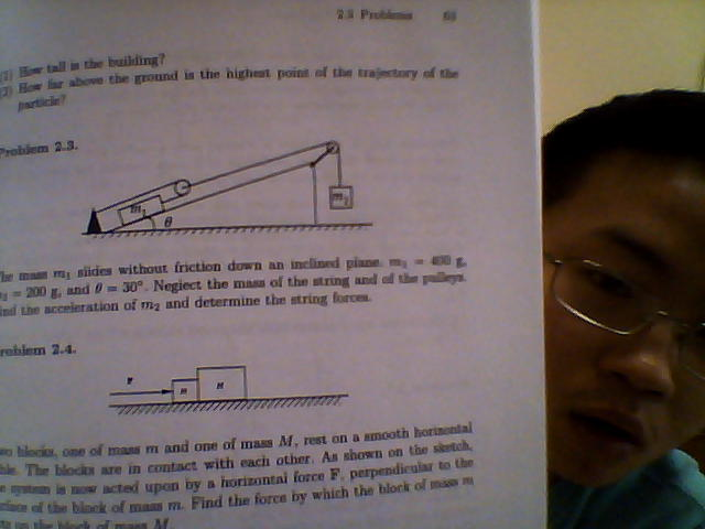 Solved The Mass M1 Slides Without Friction Down An Inclined 