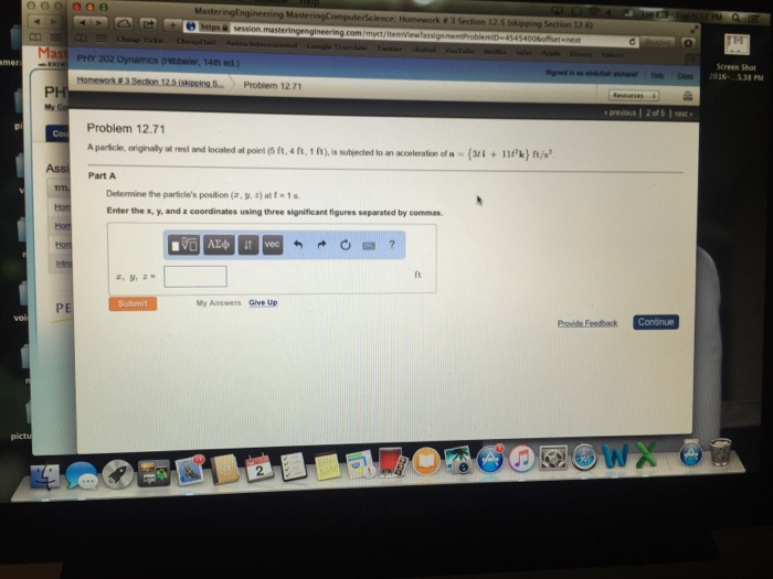 Solved A particle originally at rest and located at point | Chegg.com