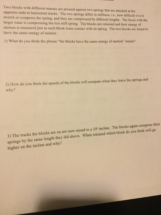 Solved Two blocks with different masses are pressed against | Chegg.com