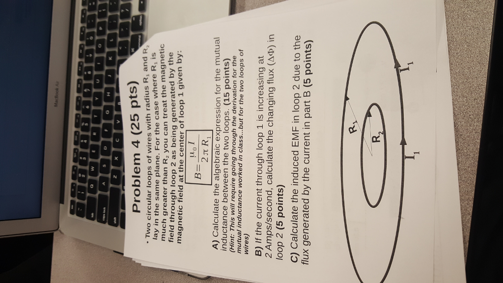 Solved Two circular loops of wires with radius R1 and R2 lay | Chegg.com