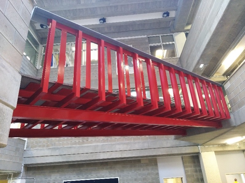 Solved A pedestrian bridge is located on the second floor of | Chegg.com