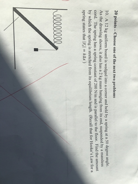 Solved A 12 kg uniform board is wedged into a comer and held | Chegg.com