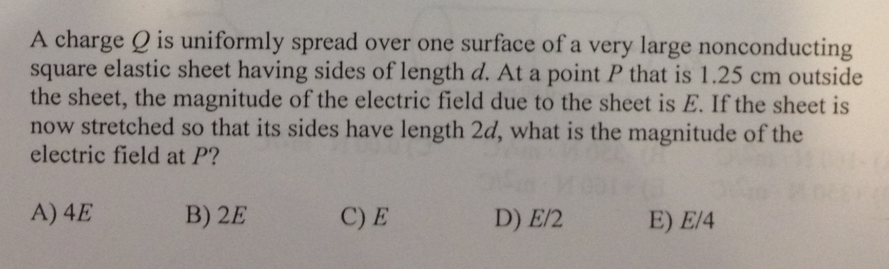 Solved A charge Q is uniformly spread over one surface of a | Chegg.com