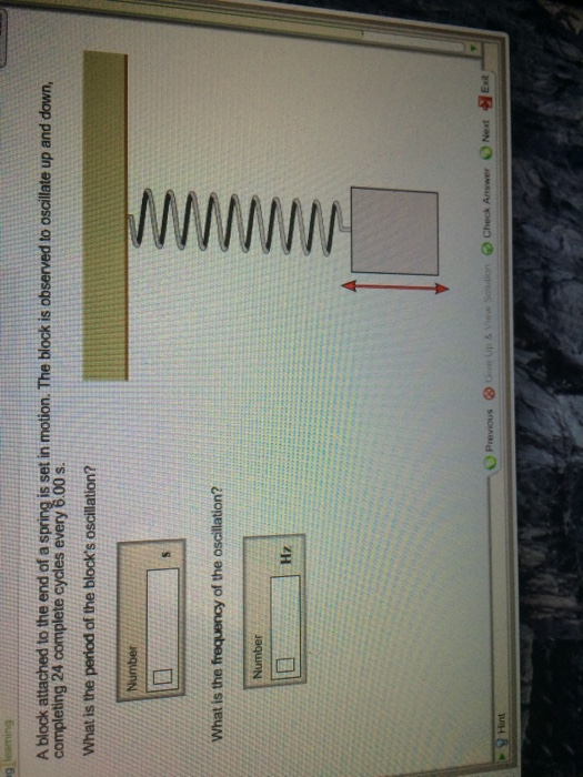 Solved A block attached to the end of a spring is set in | Chegg.com