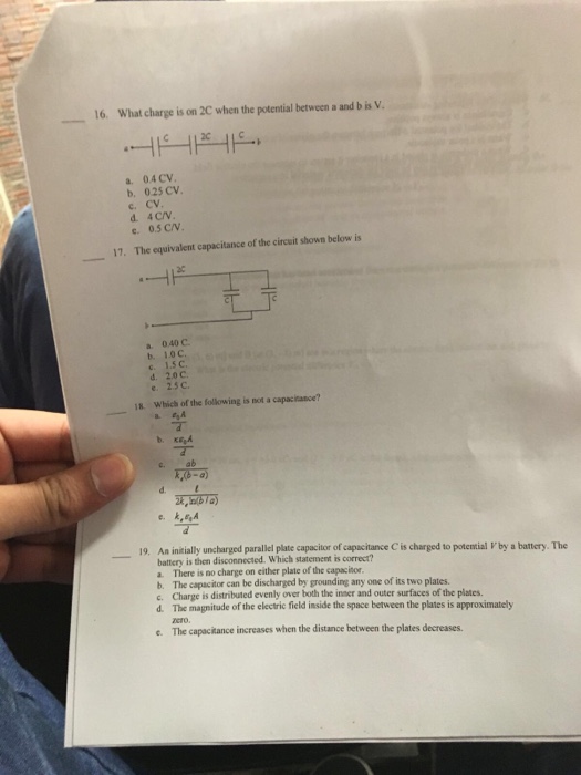 Solved What charge is on 2C when the potential between a and | Chegg.com