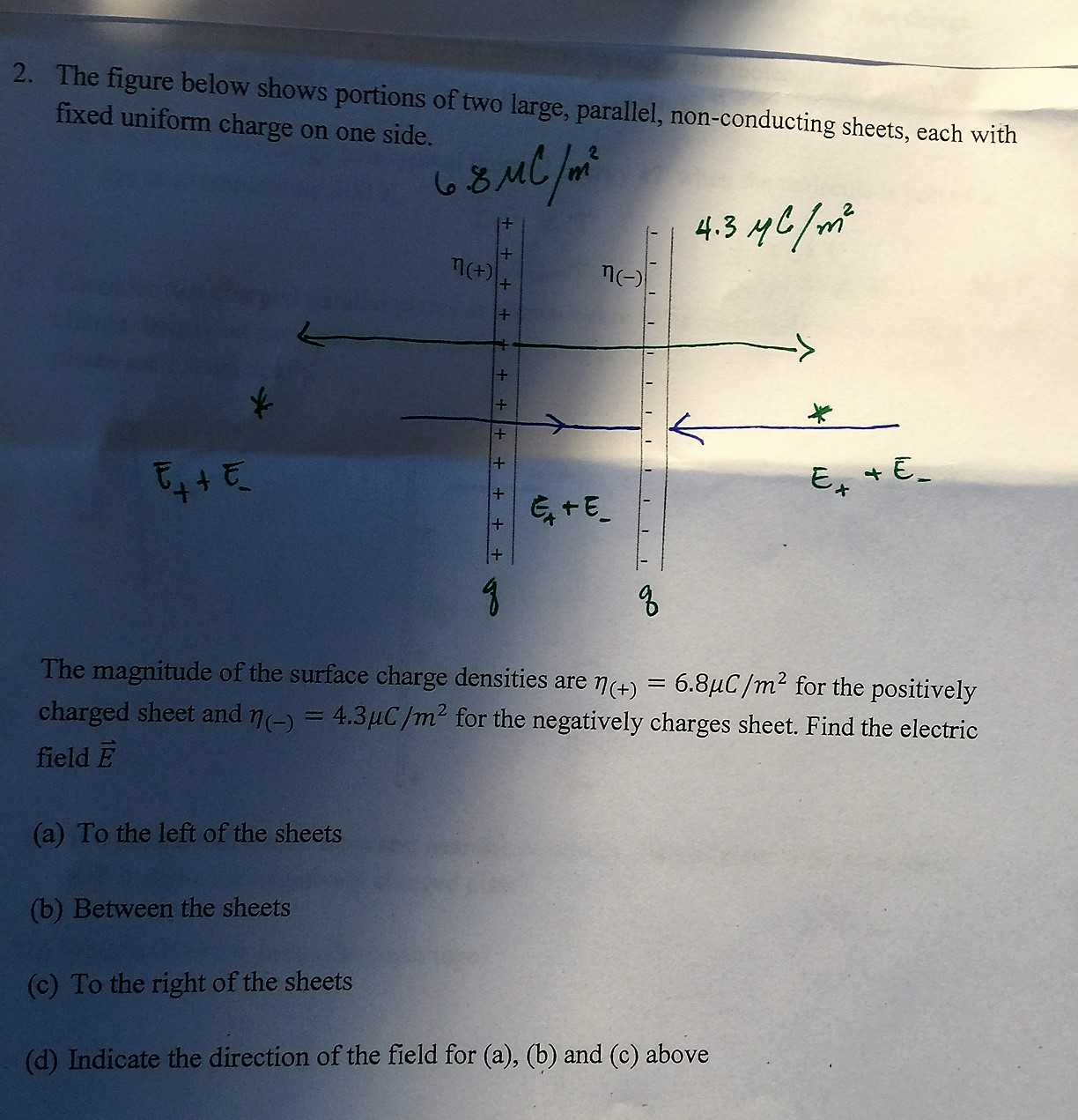 Solved The figure below shows portions of two large, | Chegg.com