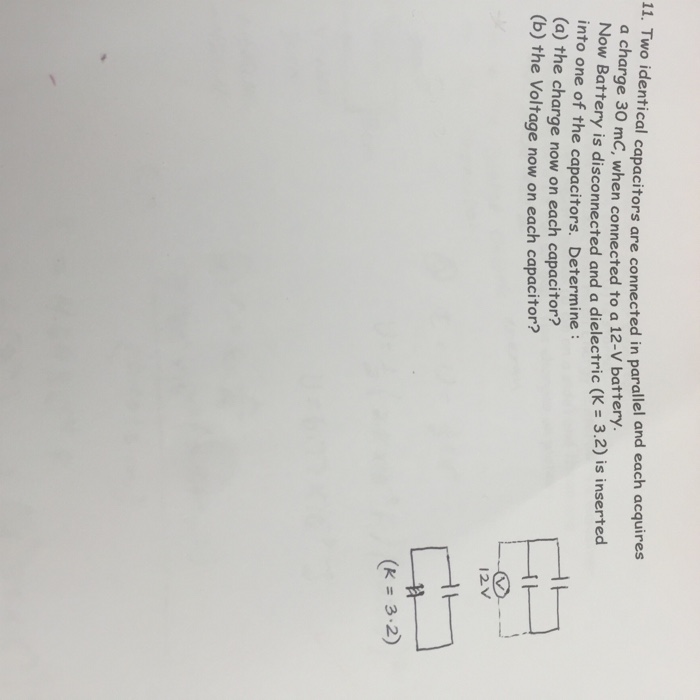 Solved Two identical capacitors are connected in parallel | Chegg.com