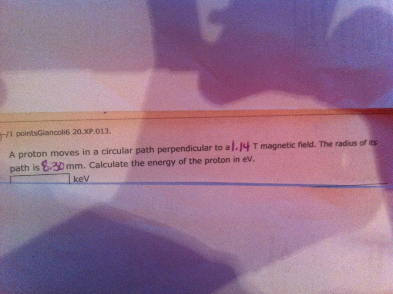 Solved A proton moves in a circular path perpendicular to a | Chegg.com